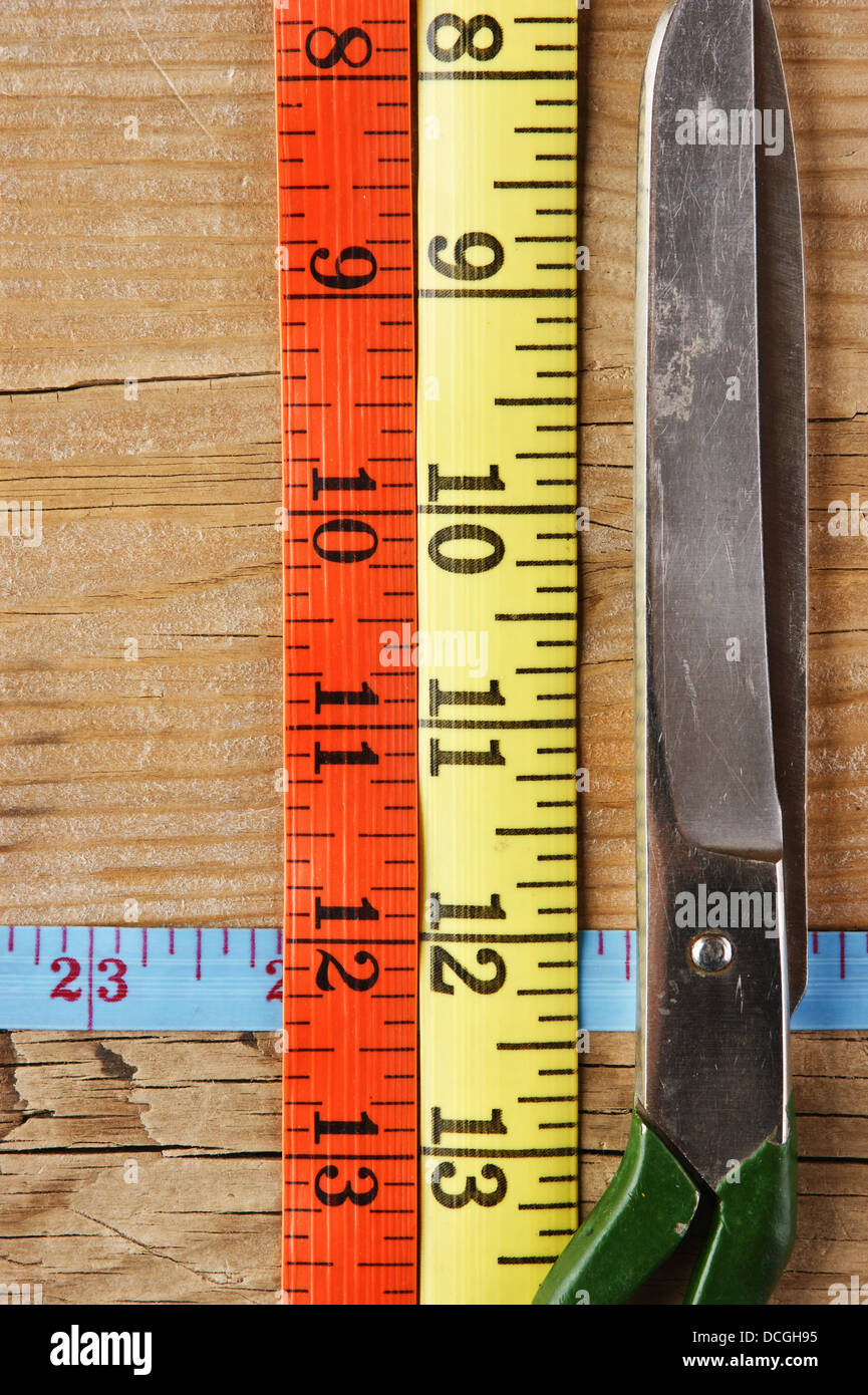 sartorial meter and scissors on the old wooden background Stock Photo ...
