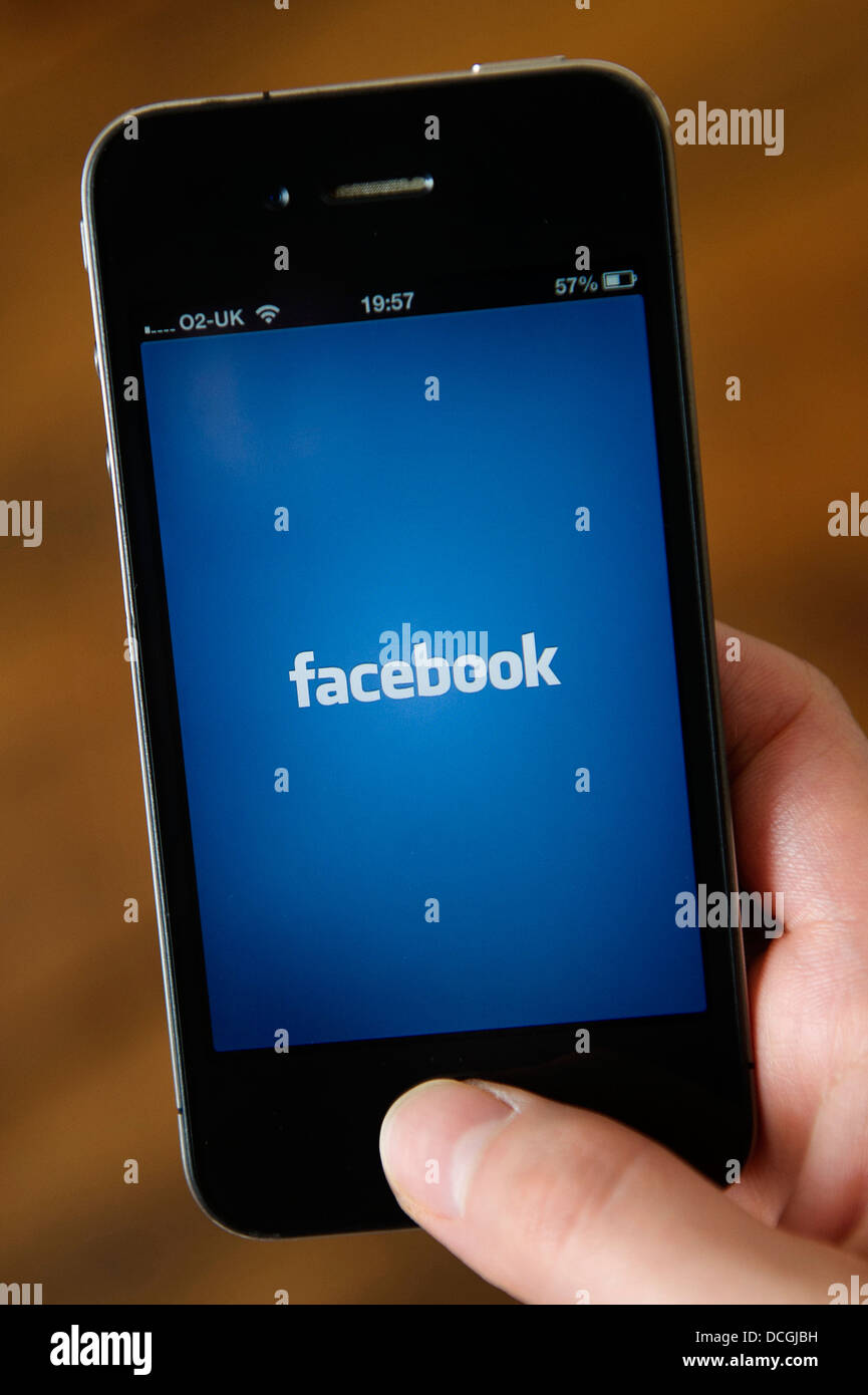 The Facebook mobile website page is picture on an iPhone Stock Photo ...