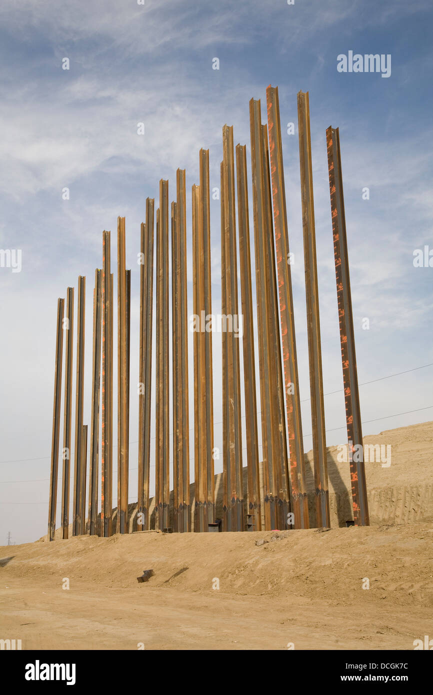 Row Of Poles On Construction Site Stock Photo - Alamy
