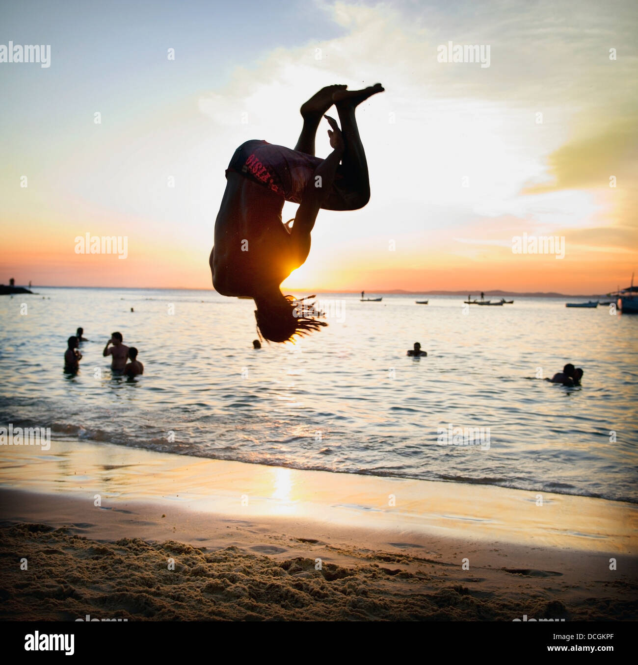Person Doing Somersault On Beach; Salvador, Bahia, Brazil Stock Photo ...