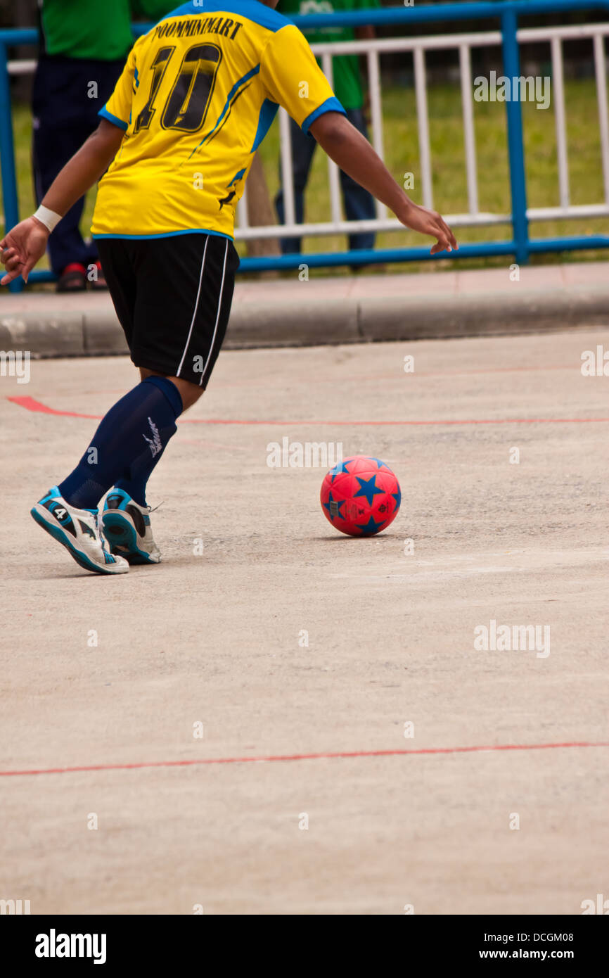 Boy kicking football one leg hi-res stock photography and images - Alamy