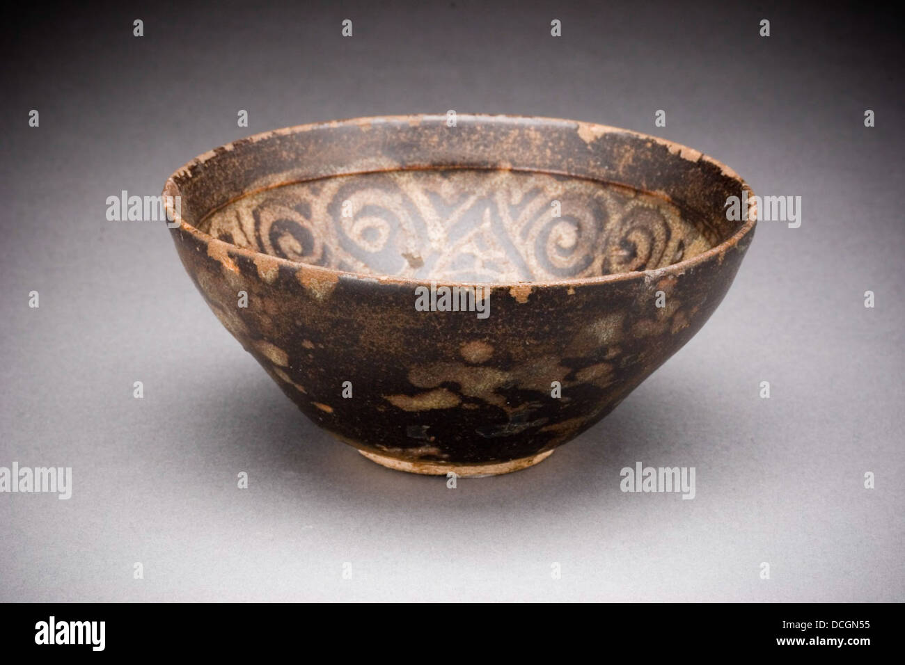 This tea bowl, known as *Chawan*, features a sword-pommel pattern, a ...