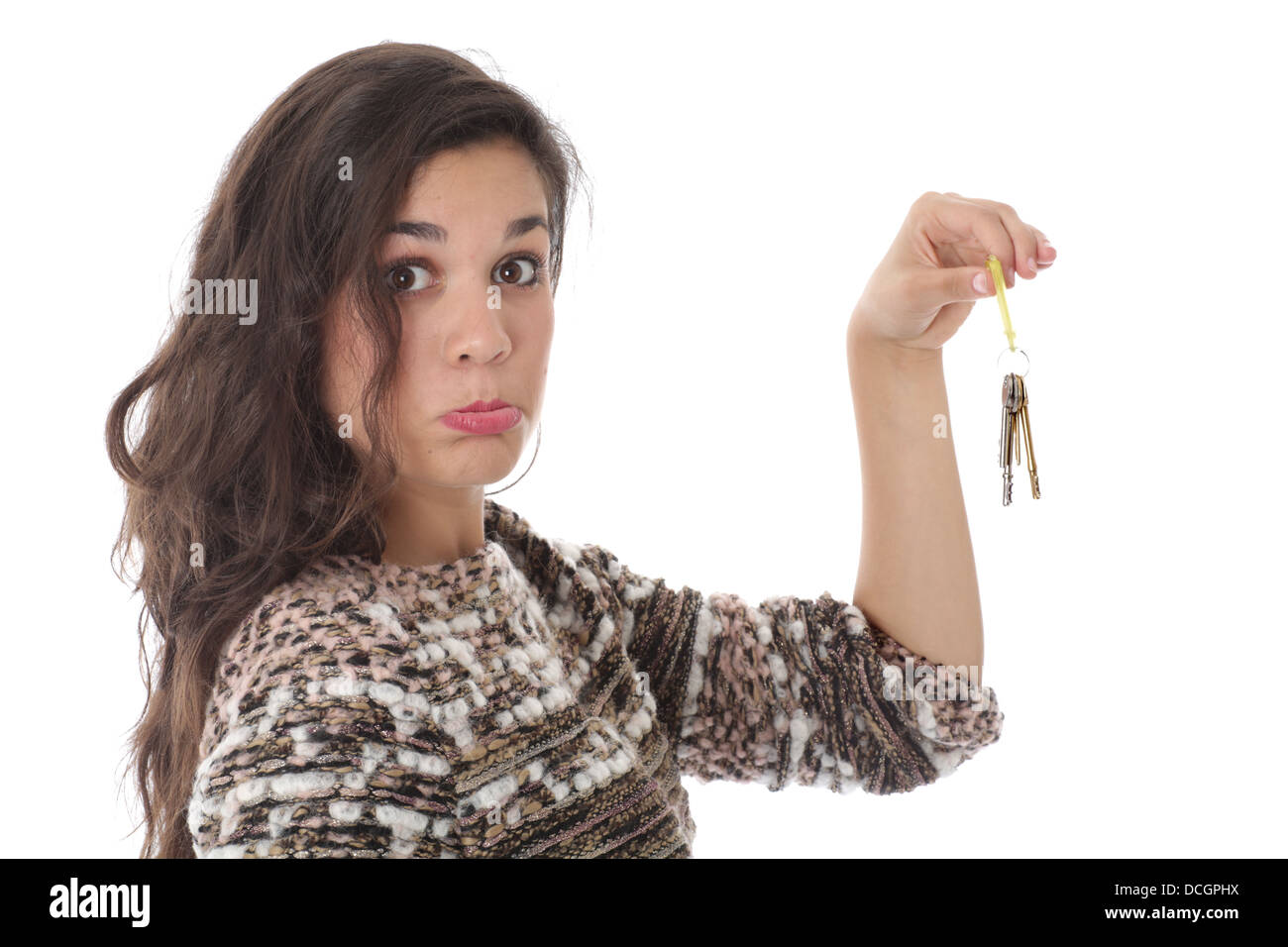 Model Released. Sad Young Woman Holding House Keys Stock Photo - Alamy