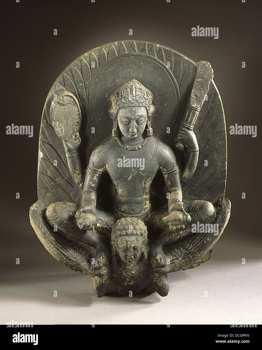 This sculpture of the Hindu god Vishnu riding his mount Garuda, part of ...