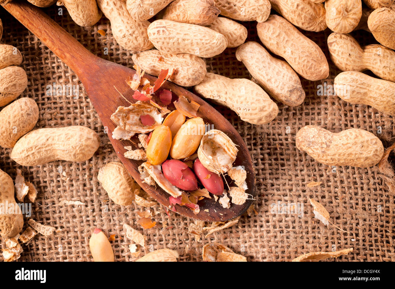 Raw shell peanuts on the wooden ladle from above Stock Photo - Alamy