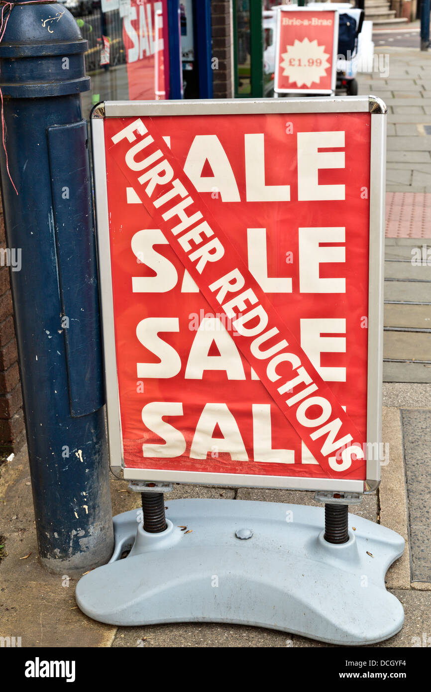 Signboard for Sale Further Reductions, seen in front of a shop on the ...