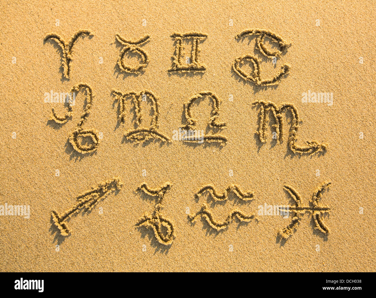 Set of zodiac signs (drawn on the facture beach sand Stock Photo - Alamy