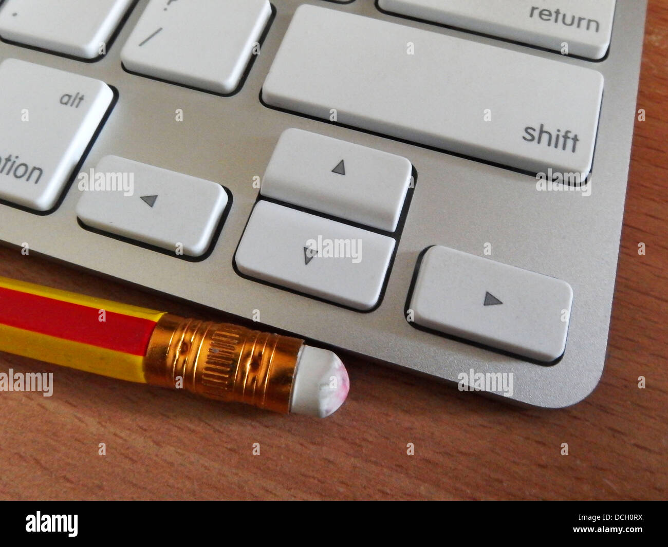 Pencil on keyboard buttons Stock Photo - Alamy