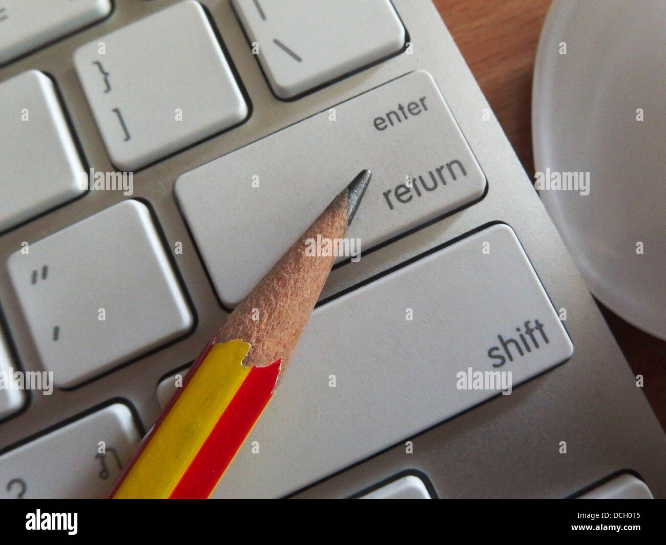 Pencil on keyboard buttons Stock Photo - Alamy