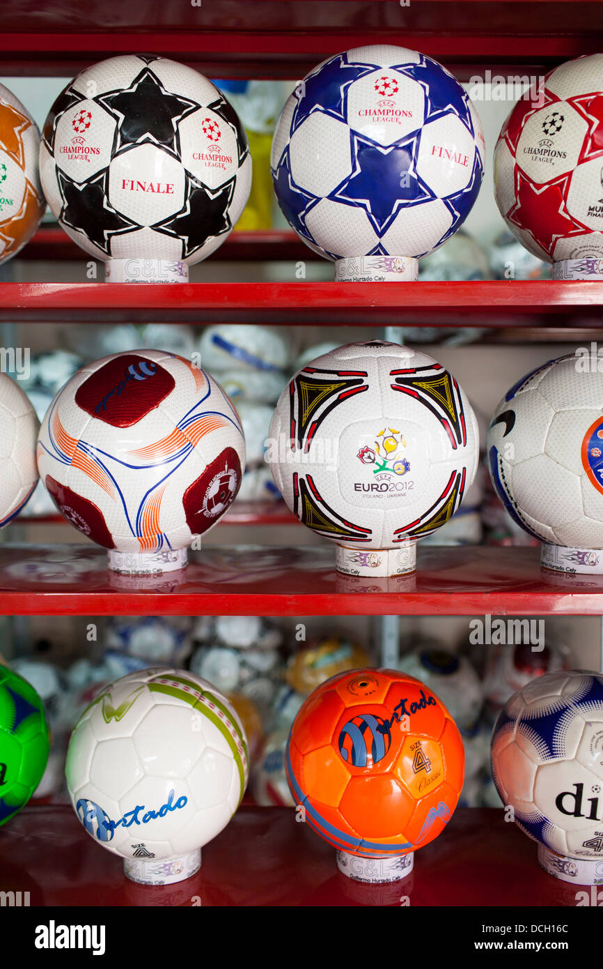 Hand made footballs on display for sale in a small football factory in ...