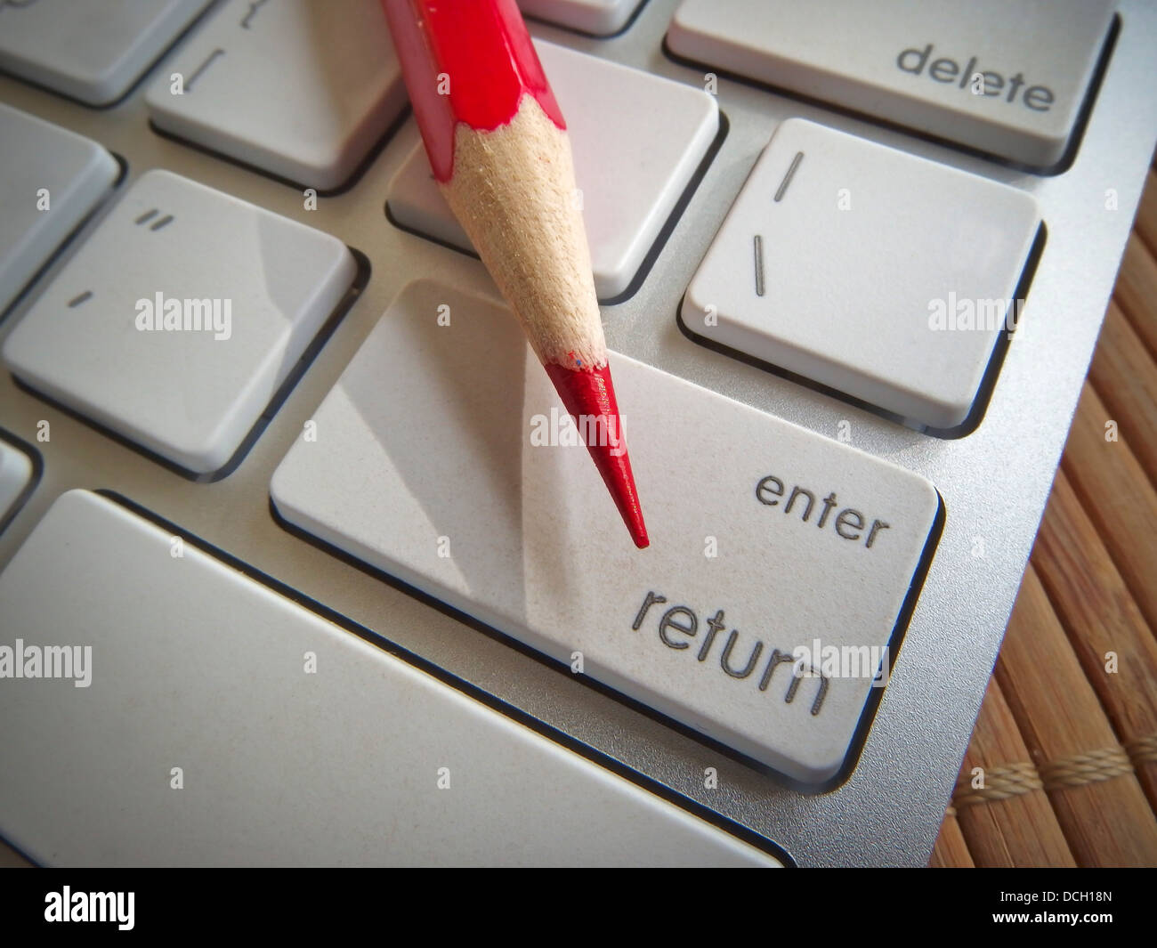 Pencil on keyboard buttons Stock Photo - Alamy
