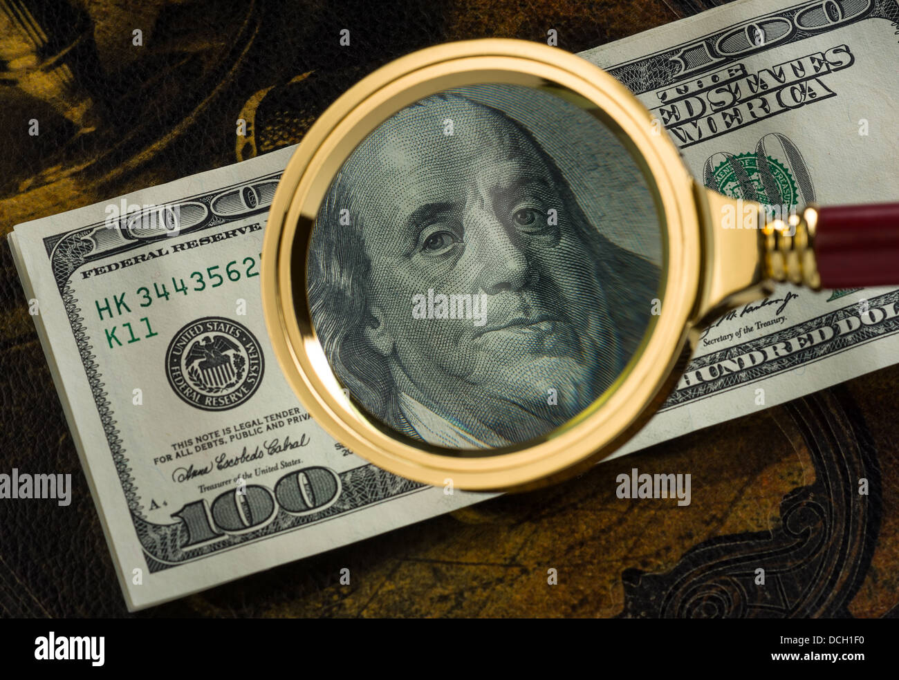 Usa dollars viewed through a magnifying glass Stock Photo - Alamy