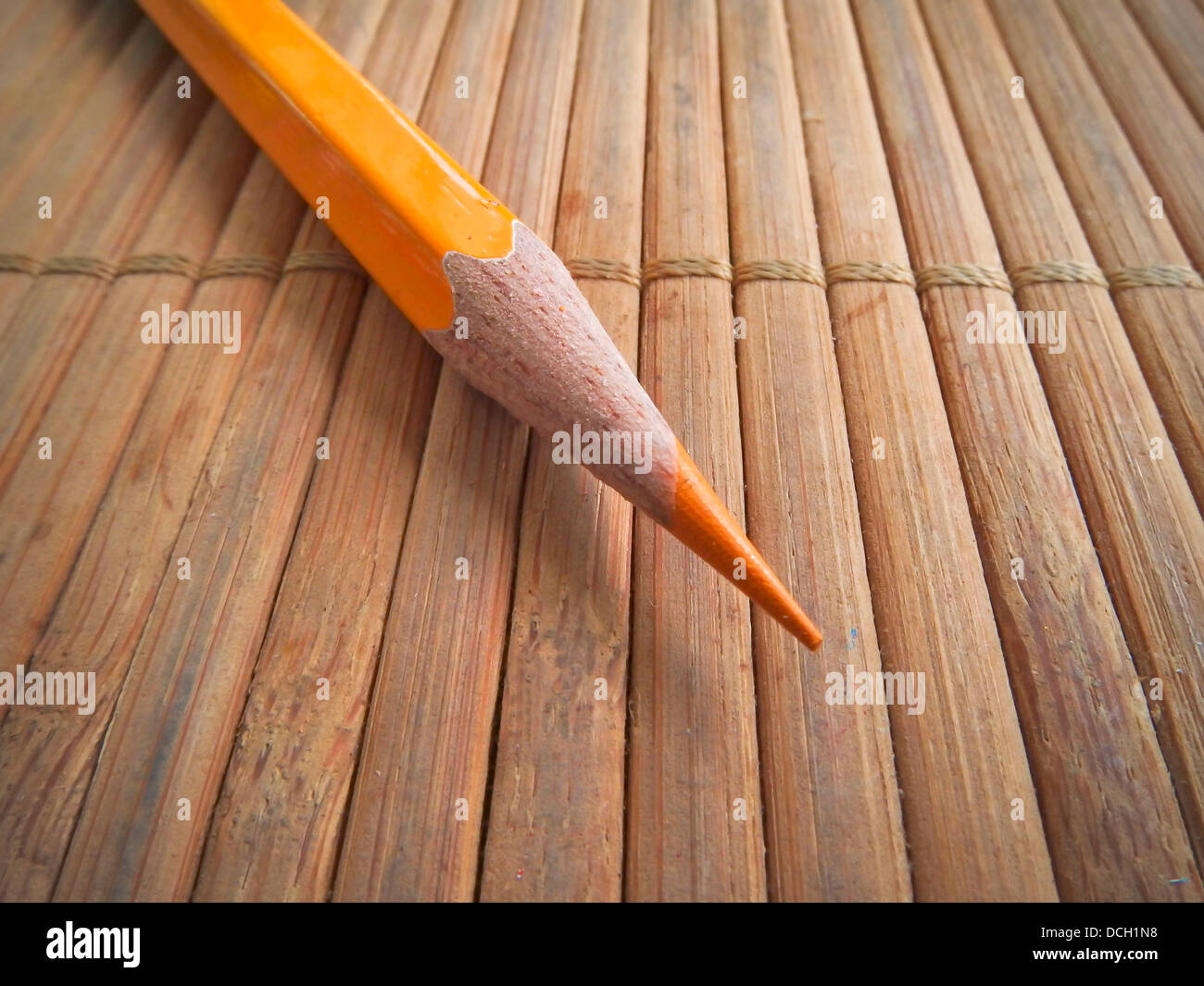 Pencil on bamboo pad background Stock Photo - Alamy