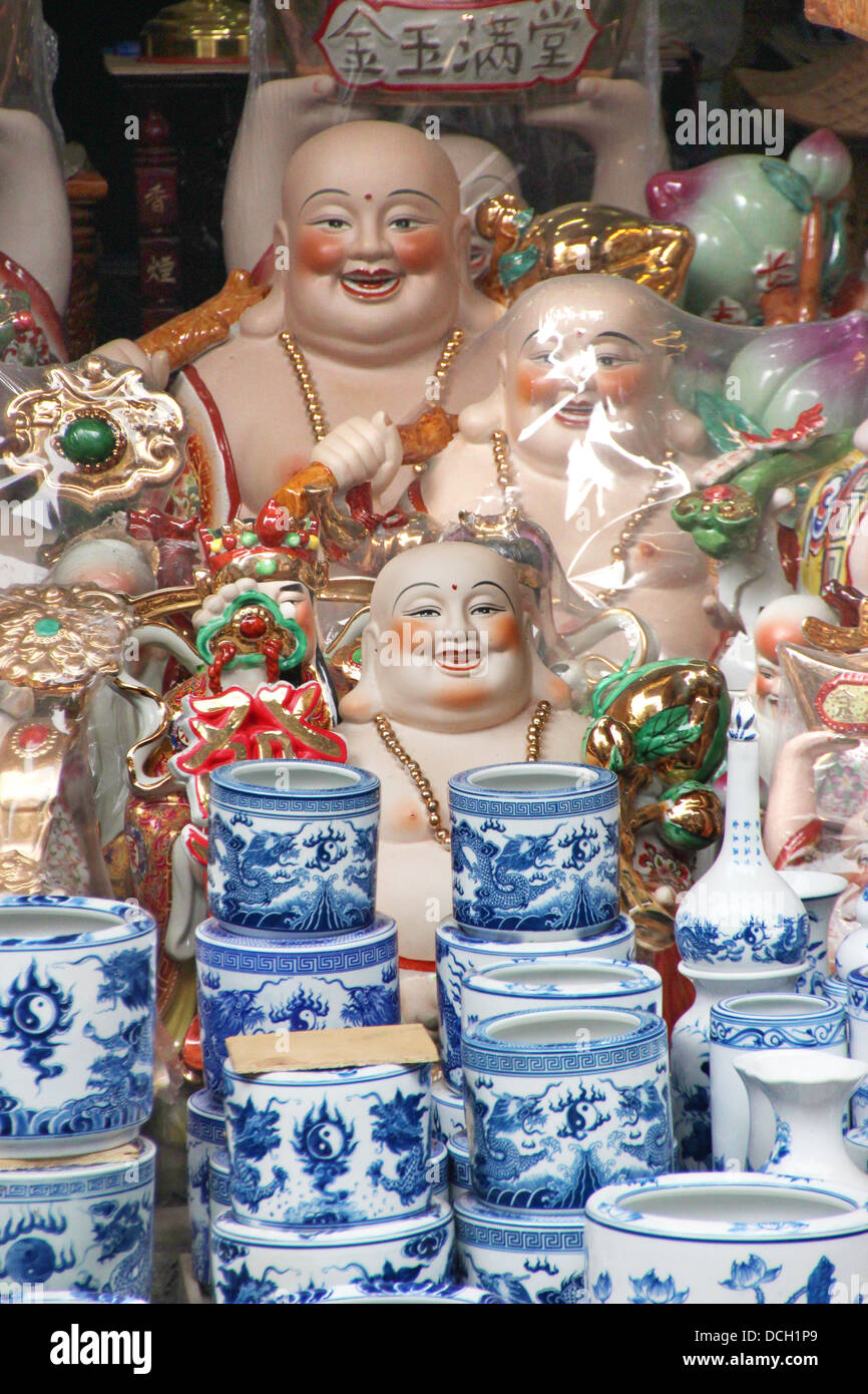 Market stall with colorful ceramic vases and Buddha figurines in Hanoi ...