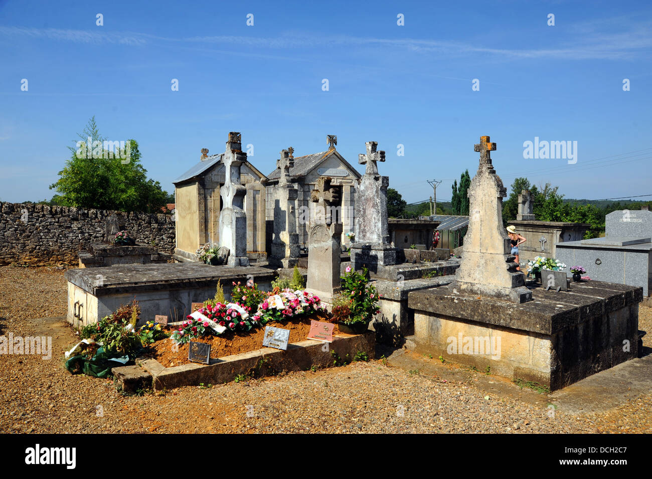 Traditional rural village graveyard at St Caprais in the Lot Region or ...