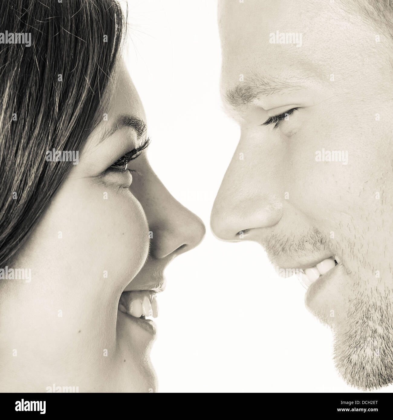 Close up faces of attractive couple, they watch each other Stock Photo ...