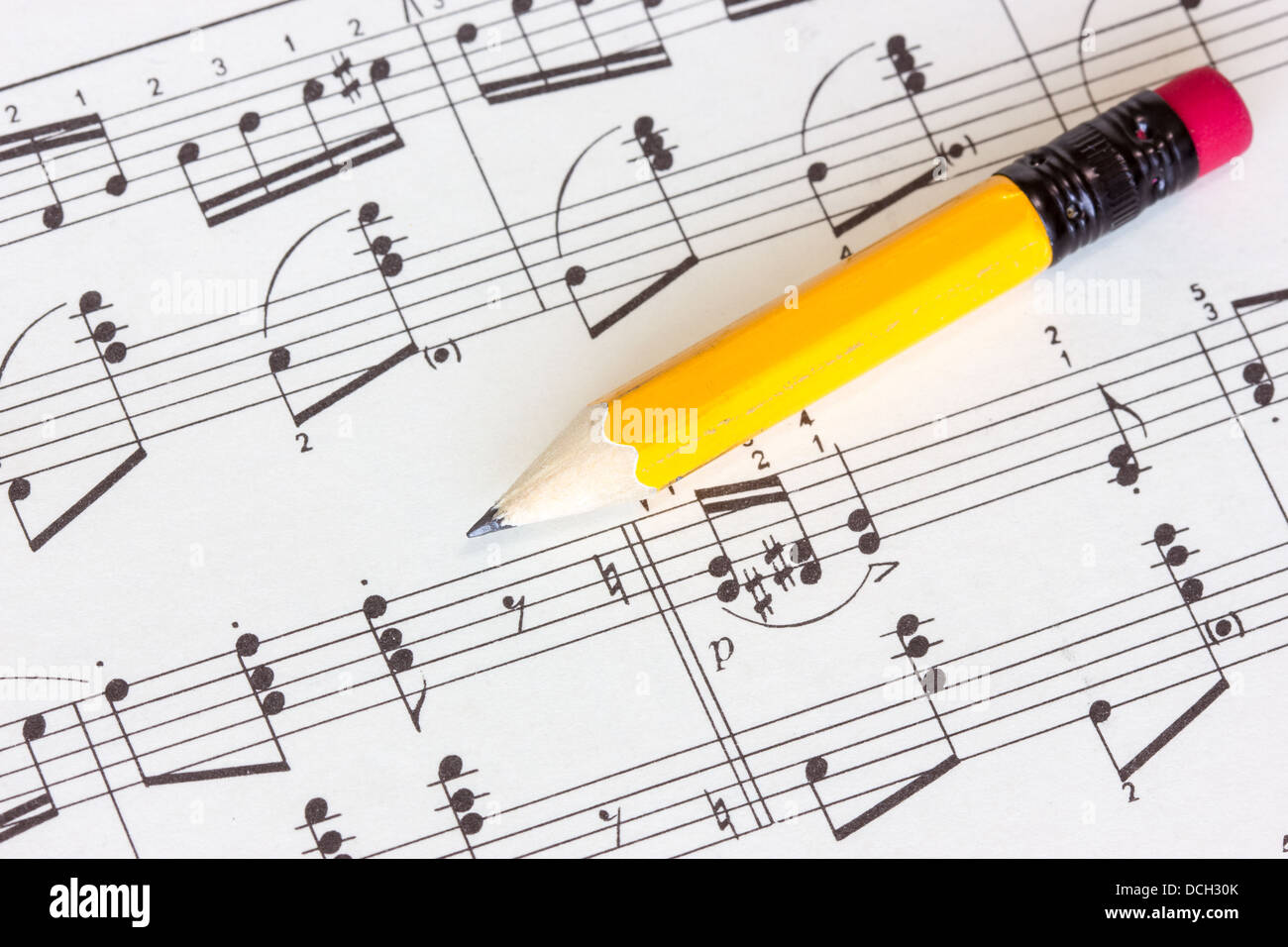 Sheet of musical notes with yellow pencil Stock Photo - Alamy
