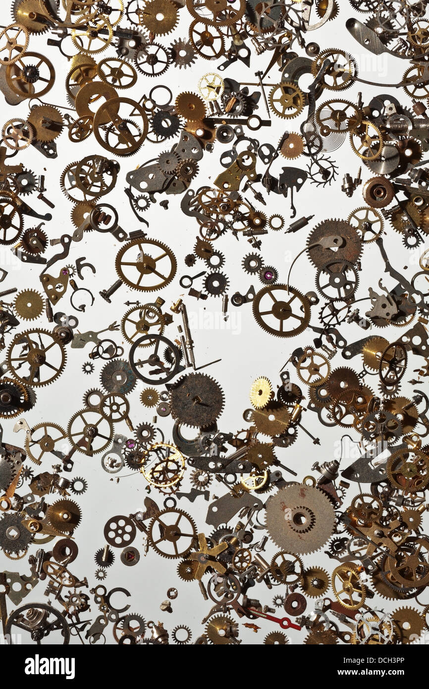 many parts and cog from a watch looking down from above background ...