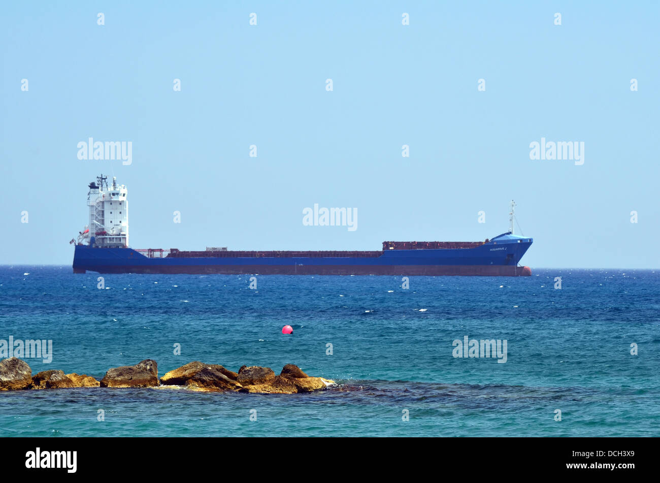 Large container ship in mediterranean coast Stock Photo - Alamy