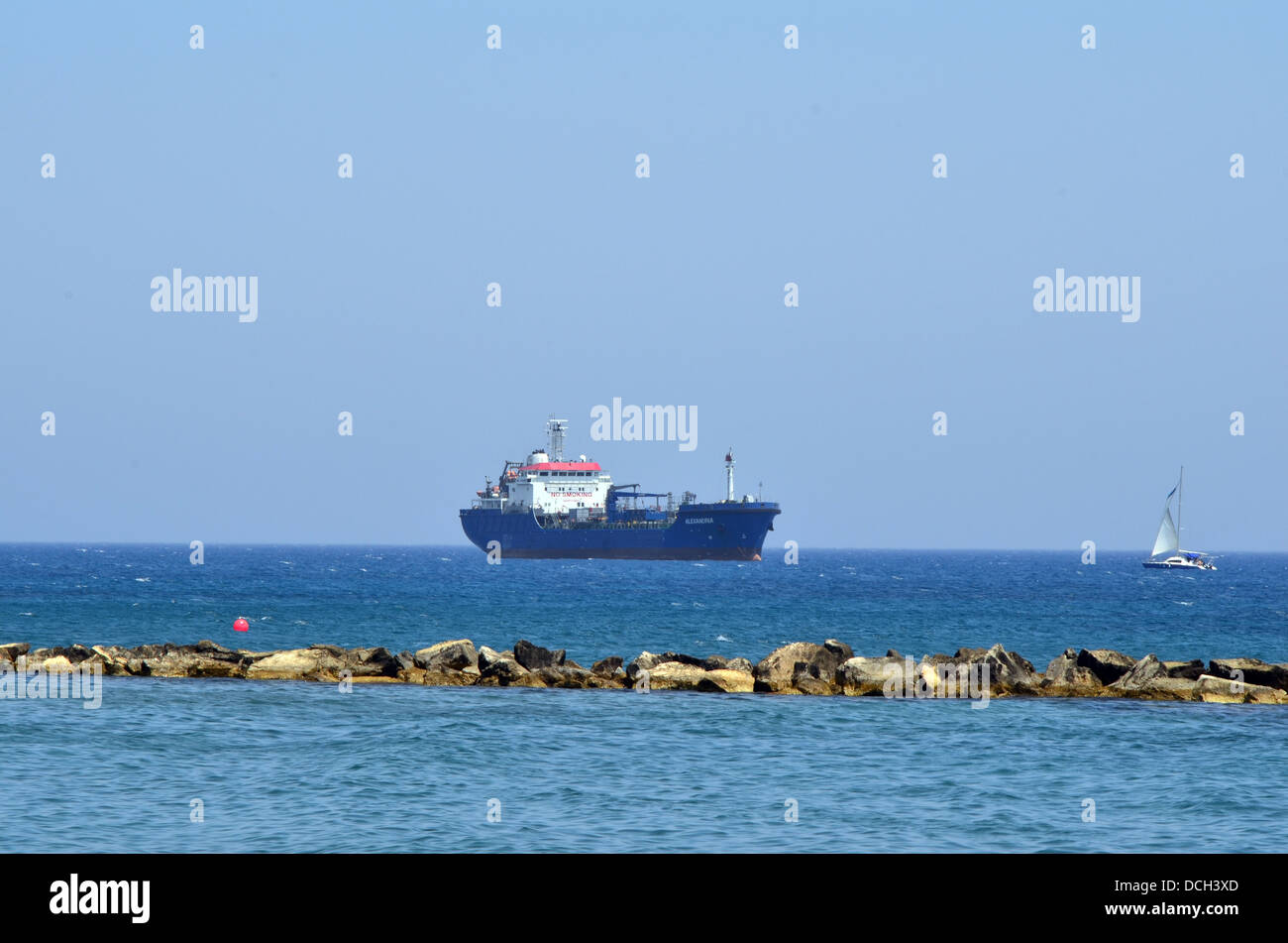 Large container ship in mediterranean coast Stock Photo - Alamy