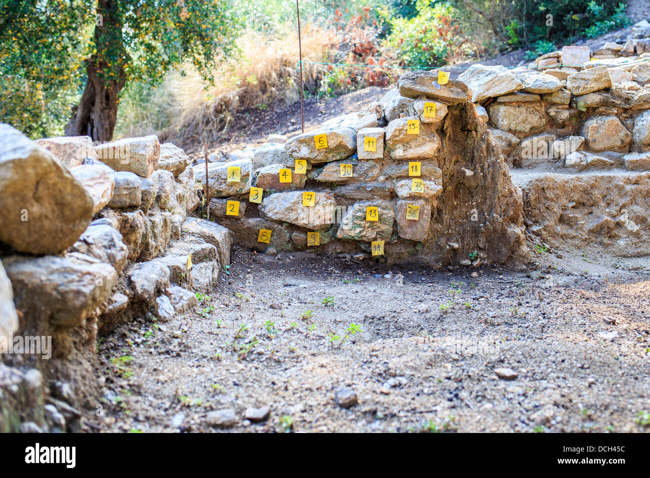 Ancient wall reconstructed by numbered stones at the archaeological ...