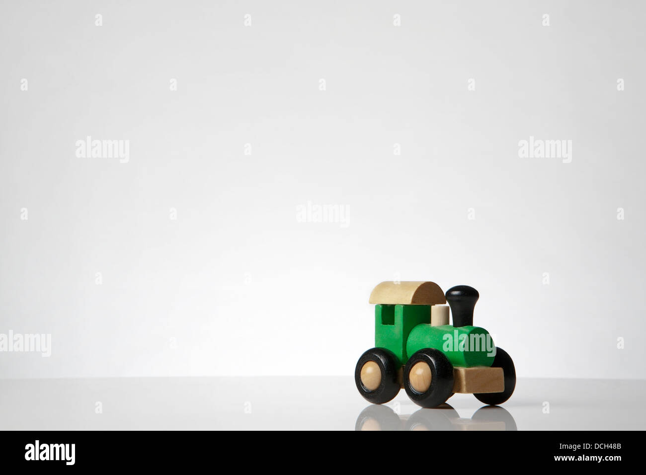 wooden toy train on white background Stock Photo - Alamy