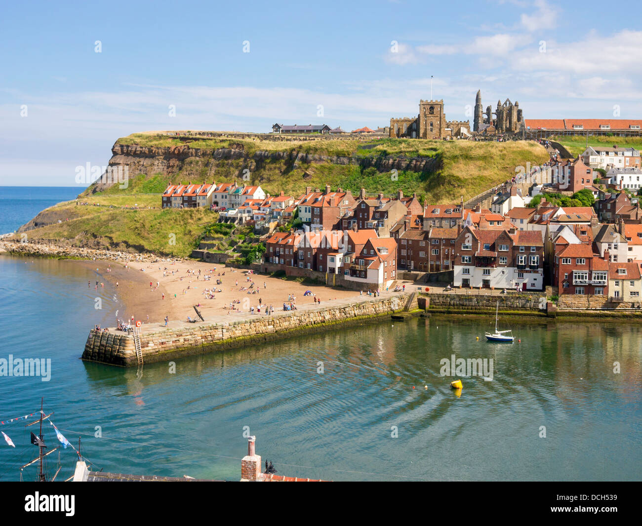 Whitby harbour with Tate Pier and cottages on the east side of town and ...