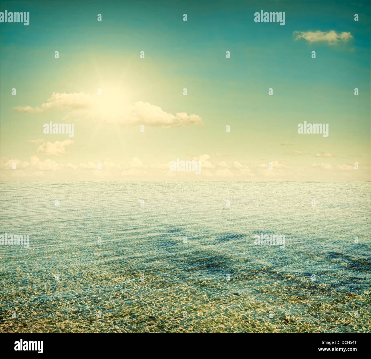 The sea is calm and the sun Stock Photo - Alamy
