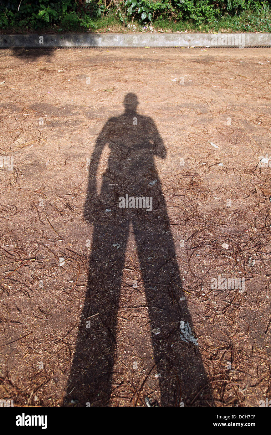 It's a photo of a shadow shape on the ground. It looks very tall or ...