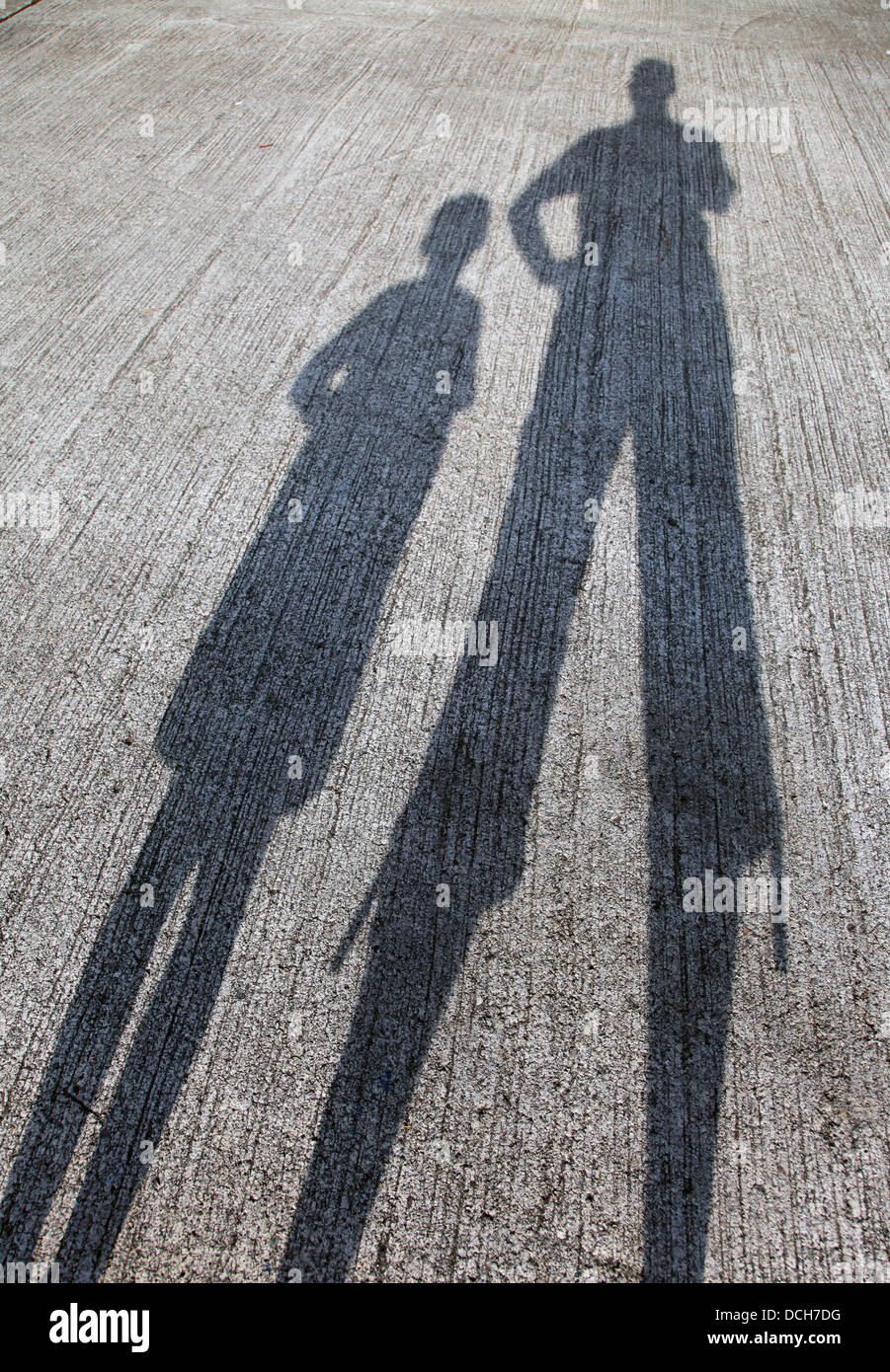 It's a photo of a shadow shape on the ground. It looks very tall or ...