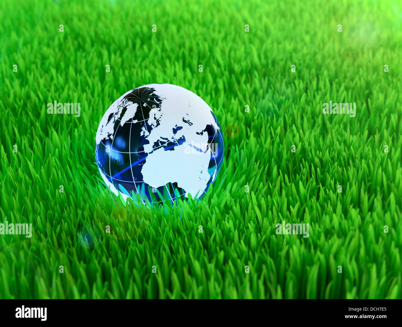 Blue crystal globe on grass symbol of environmental conservation Stock ...