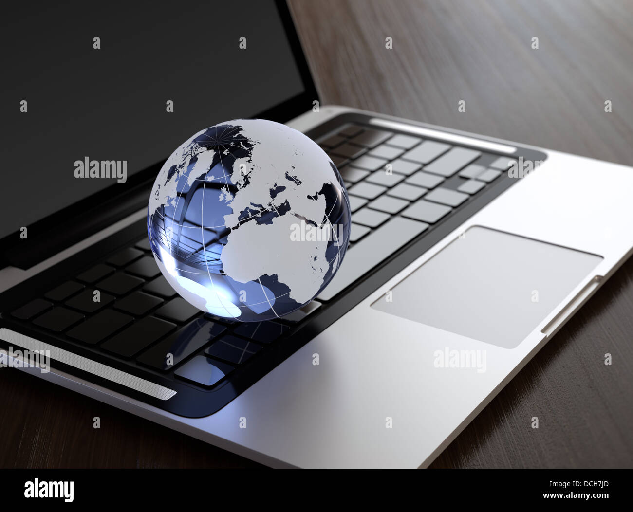 3D image of modern laptop and crystal globe on wooden desk Stock Photo ...