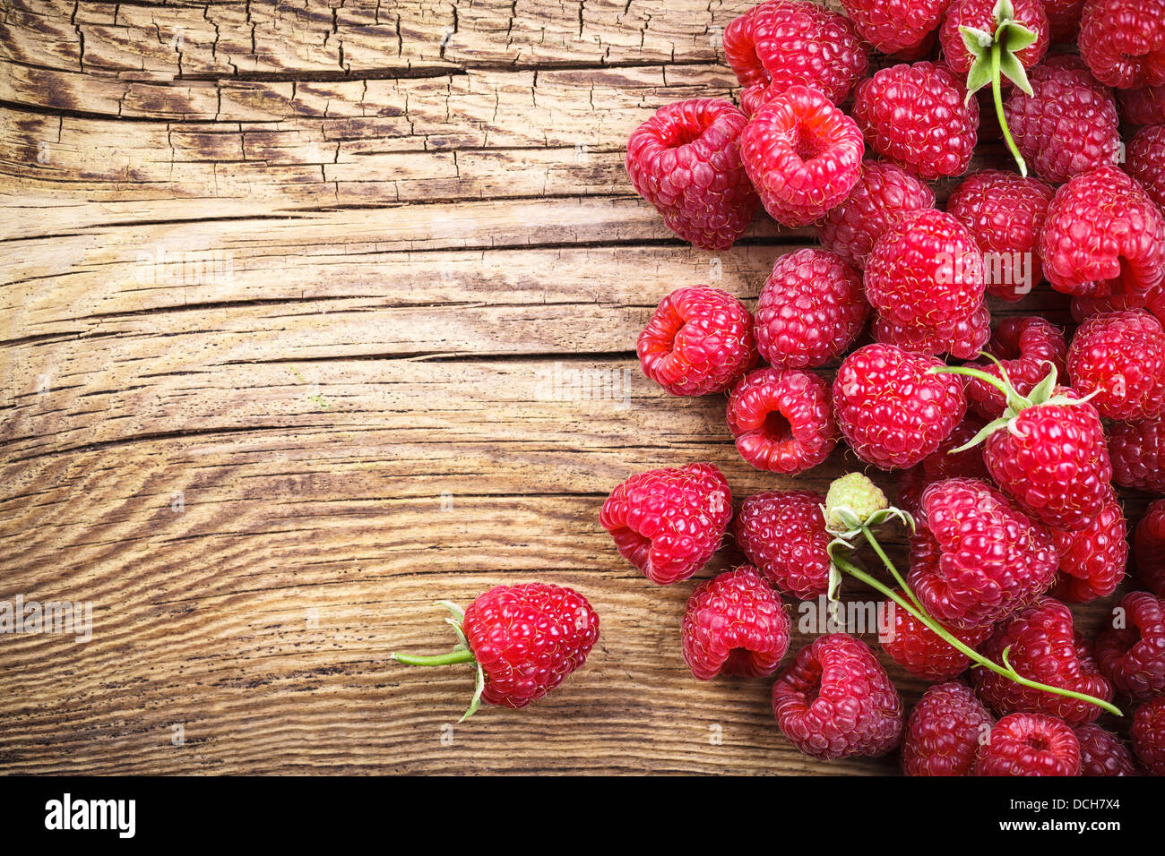 Raspberries on wooden table background with copy space. Top view Stock ...