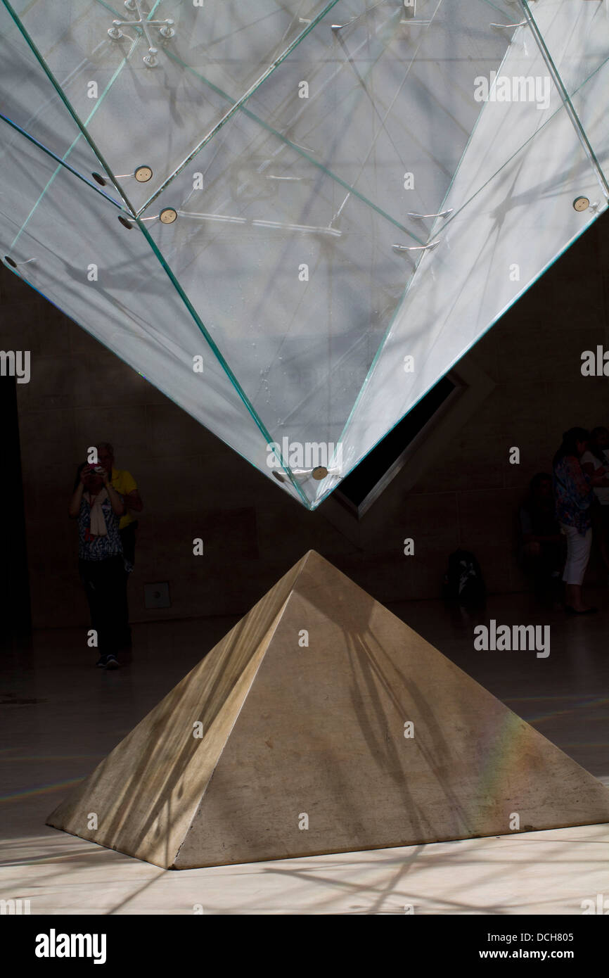 The twin pyramids of the Louvre placed under the structure Stock Photo ...