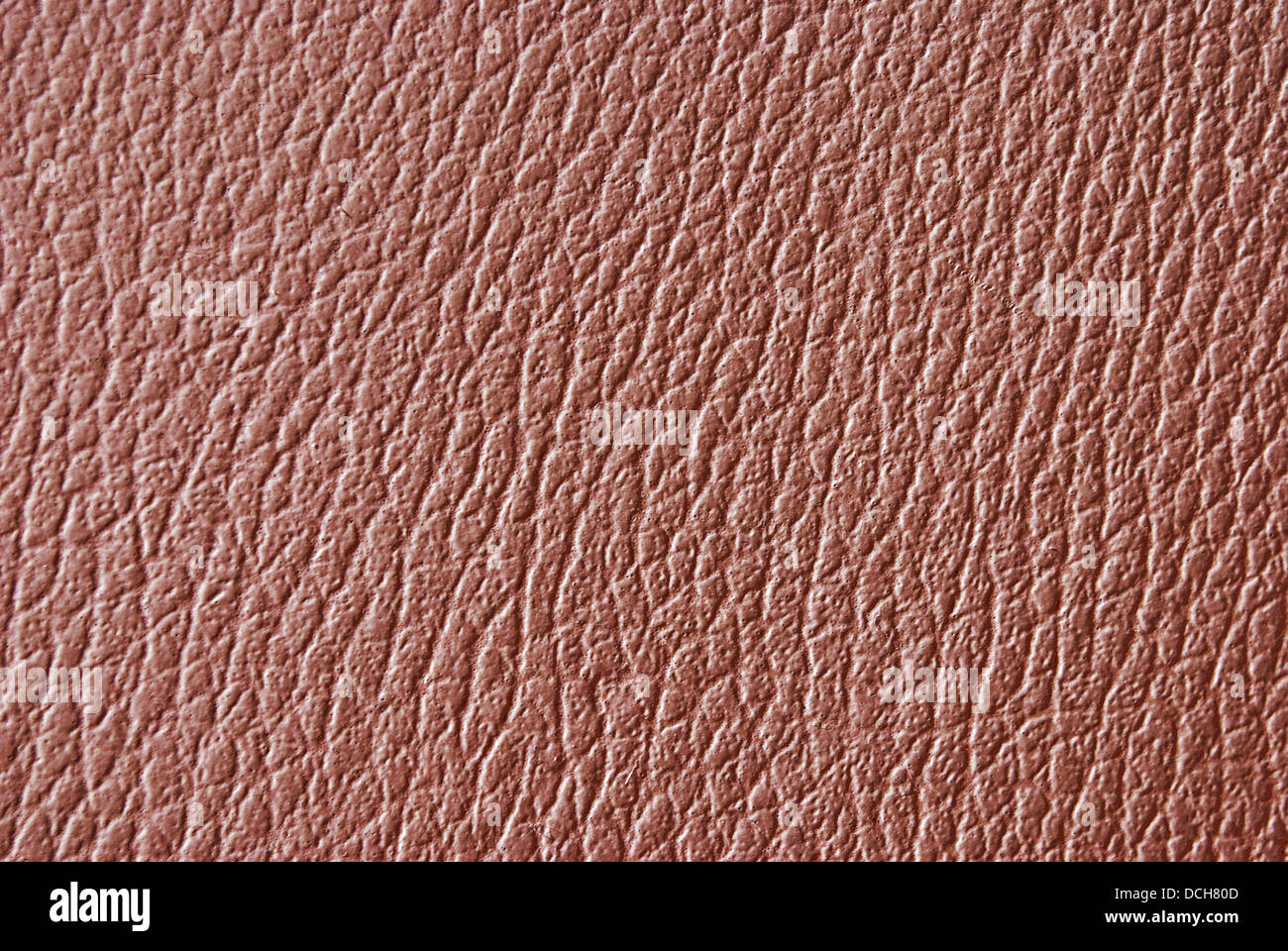 Salmon pink synthetic colored or tinted leather texture or background ...