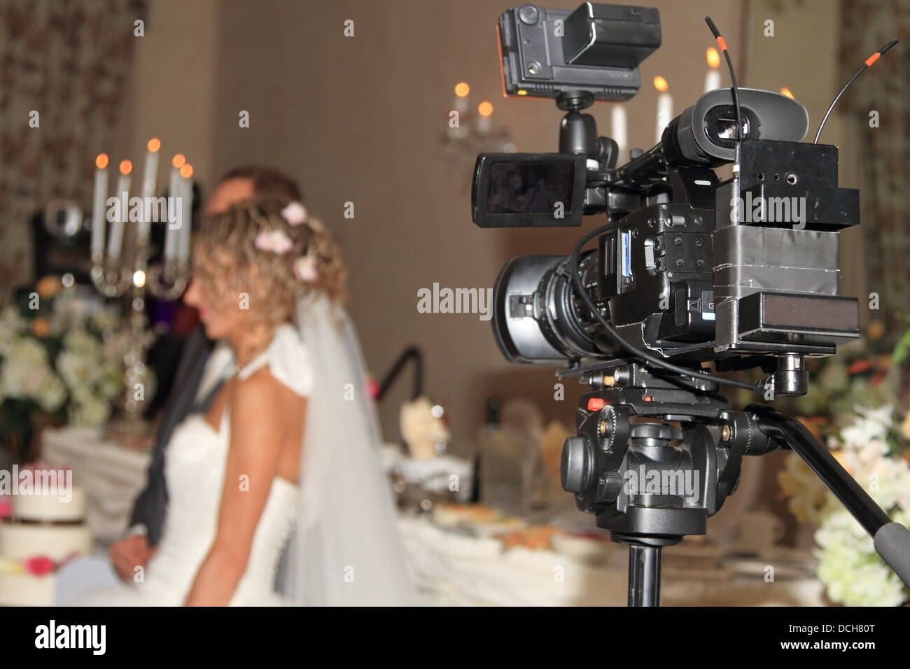 Wedding couple recording on camera Stock Photo - Alamy