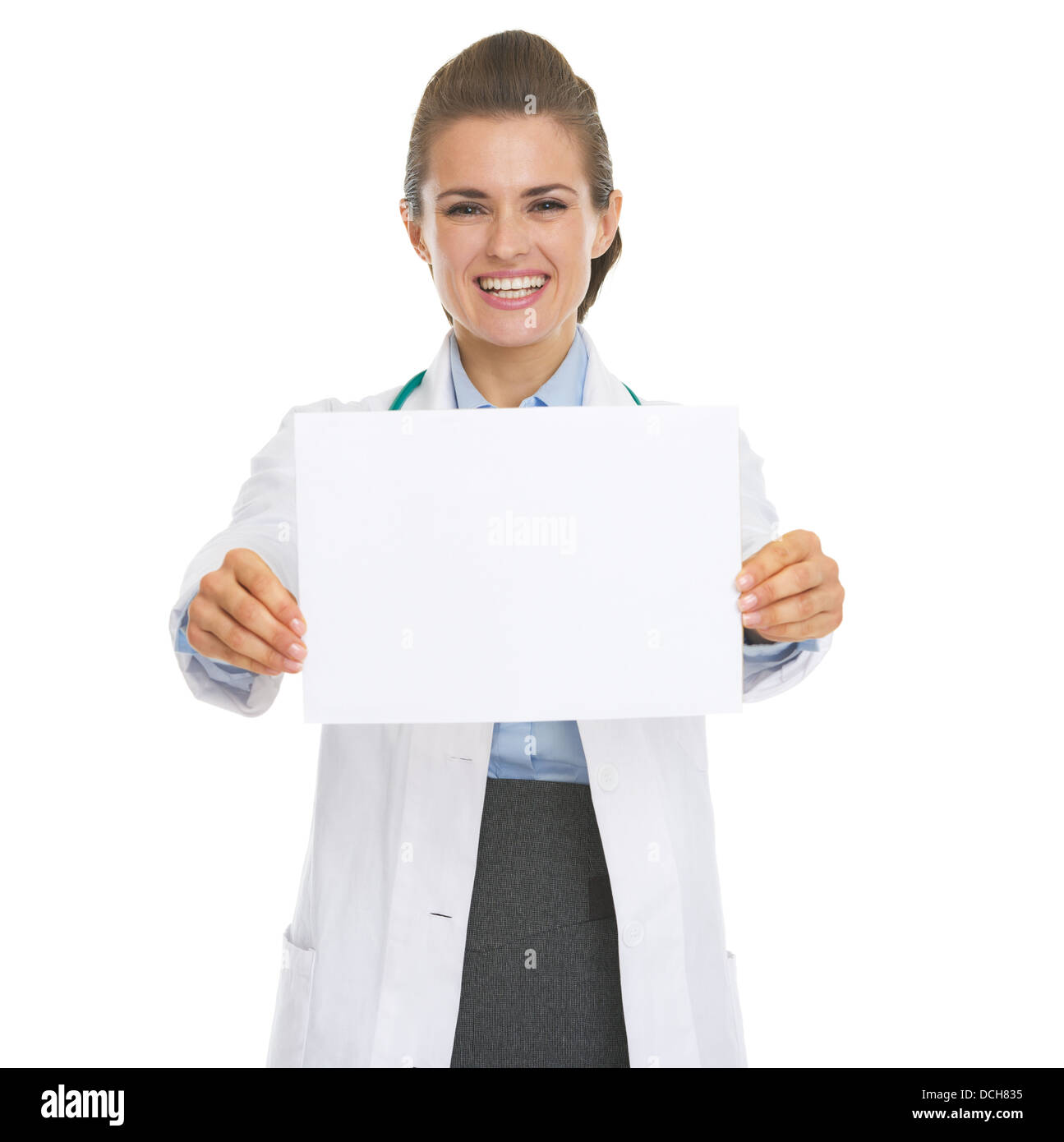 Smiling doctor woman showing blank paper sheet Stock Photo - Alamy