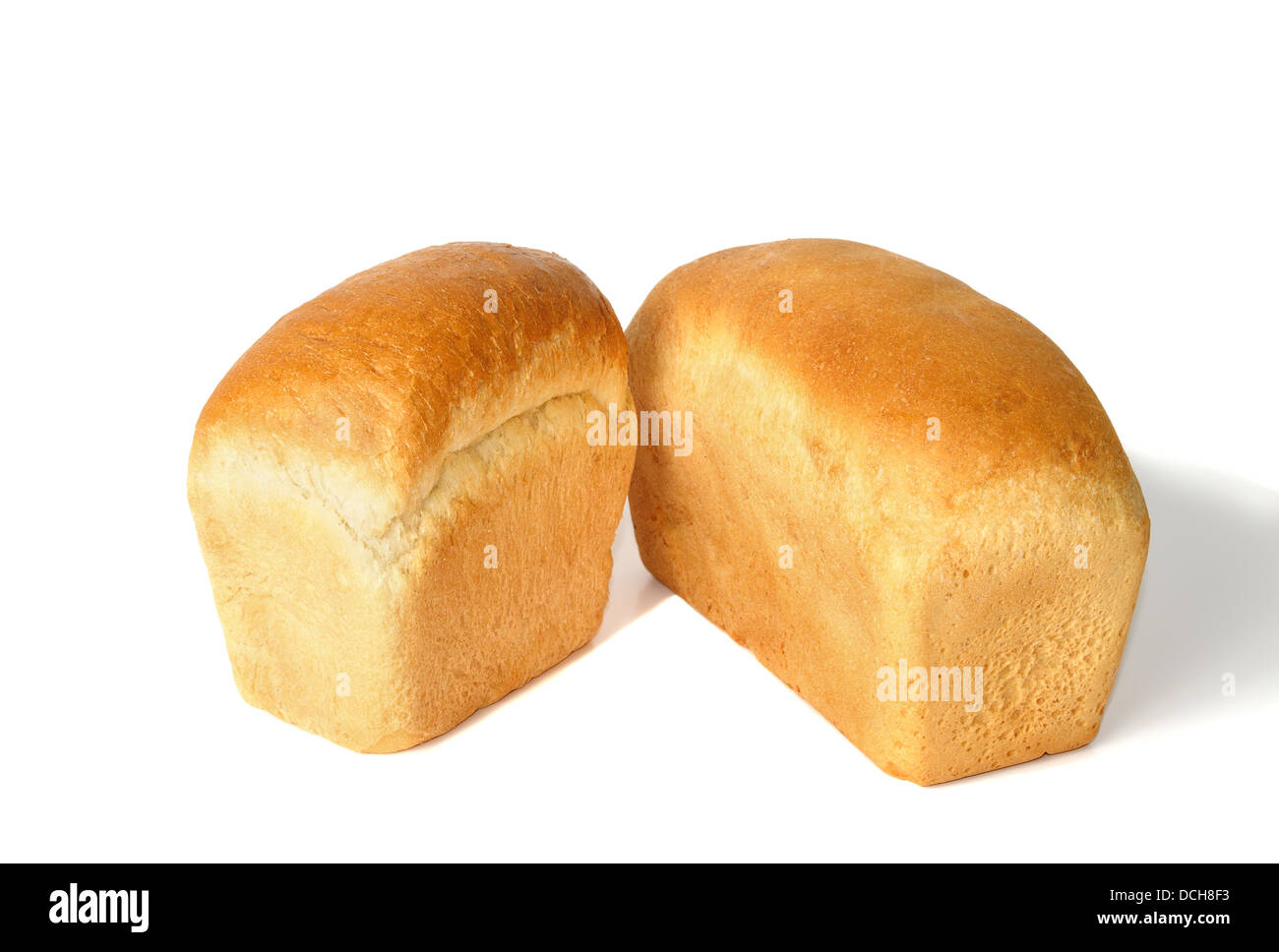 Two loaves of bread isolated over white Stock Photo - Alamy