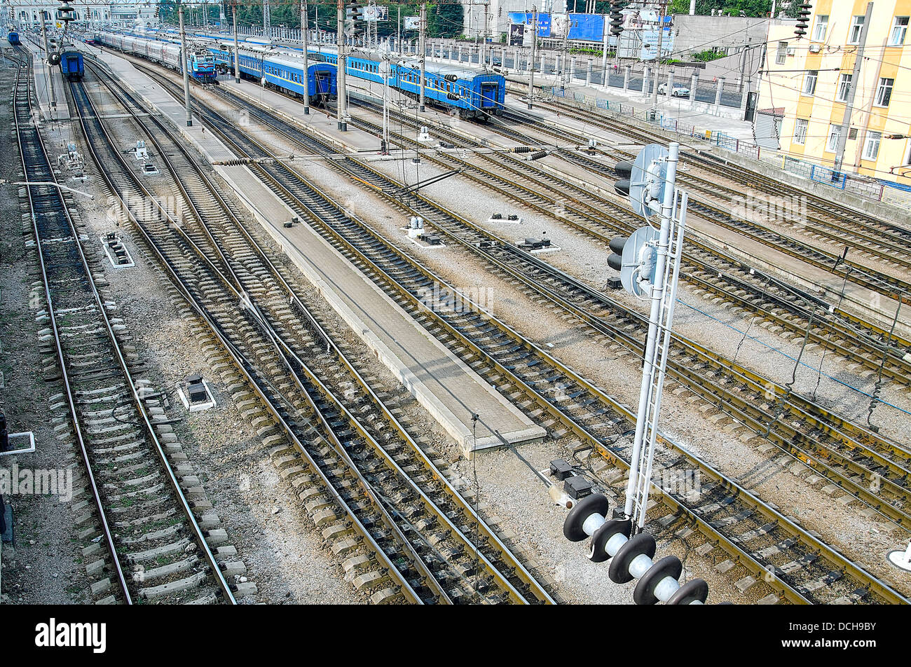 Railway junction. Perspective of crossing rails, traffic lights and ...