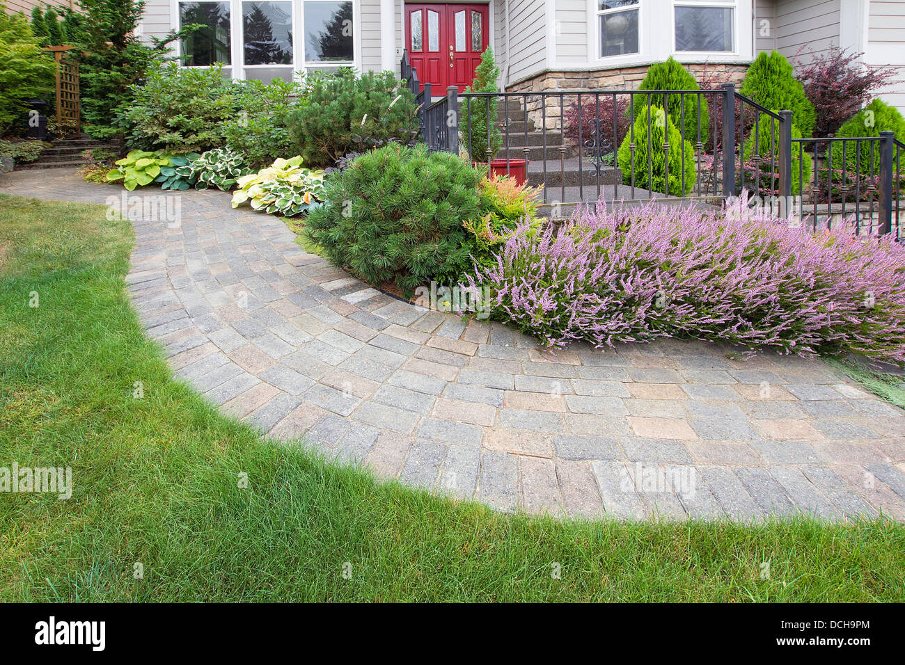 Front Yard Garden Curve Brick Paver Path with Green Grass Lawn ...