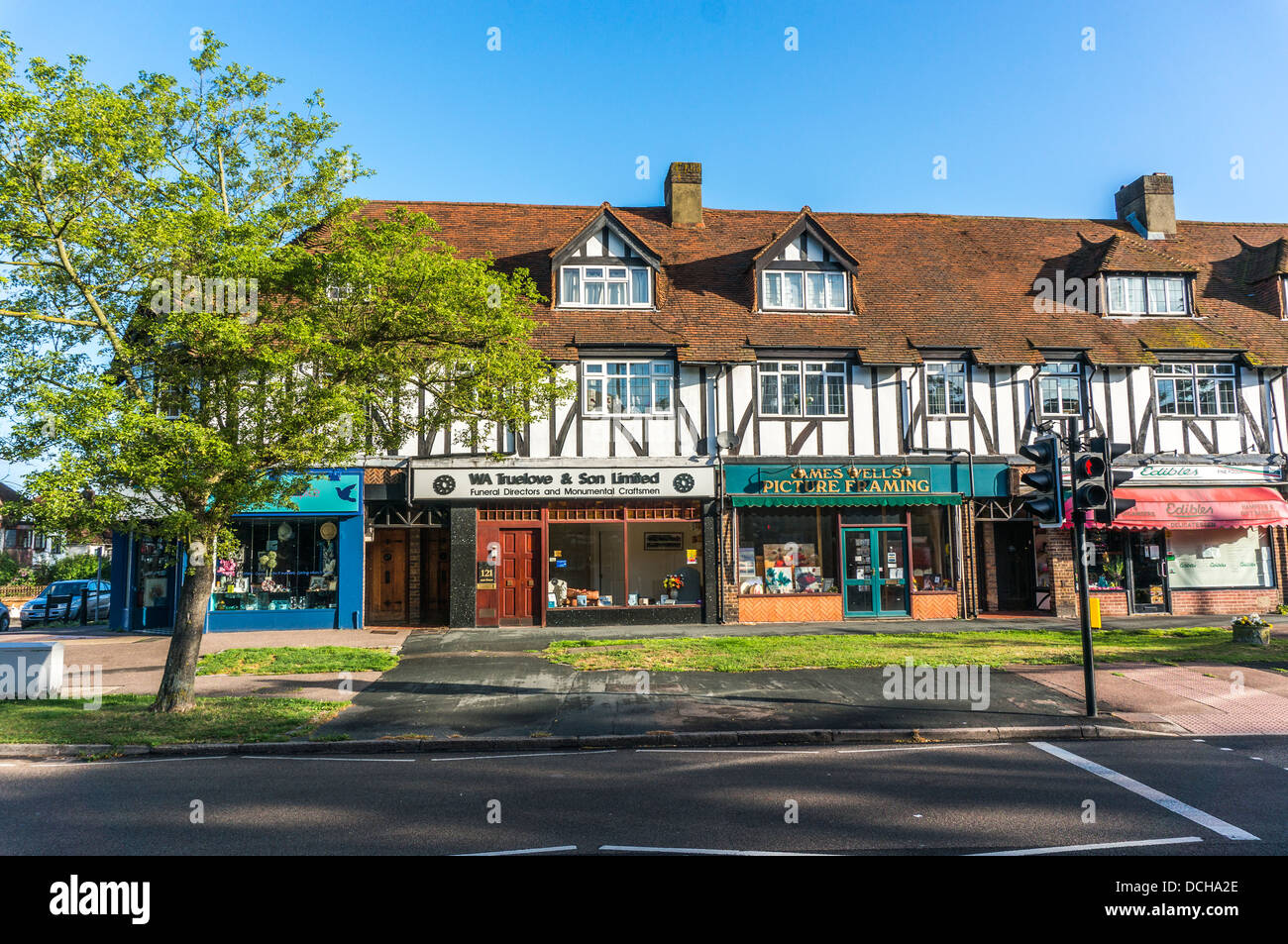 Parade of shops on Banstead village High Street, on a quiet Sunday ...