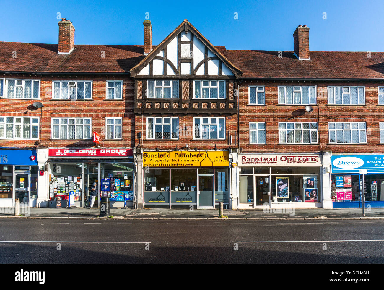 Parade of shops on Banstead village High Street, on a quiet Sunday ...