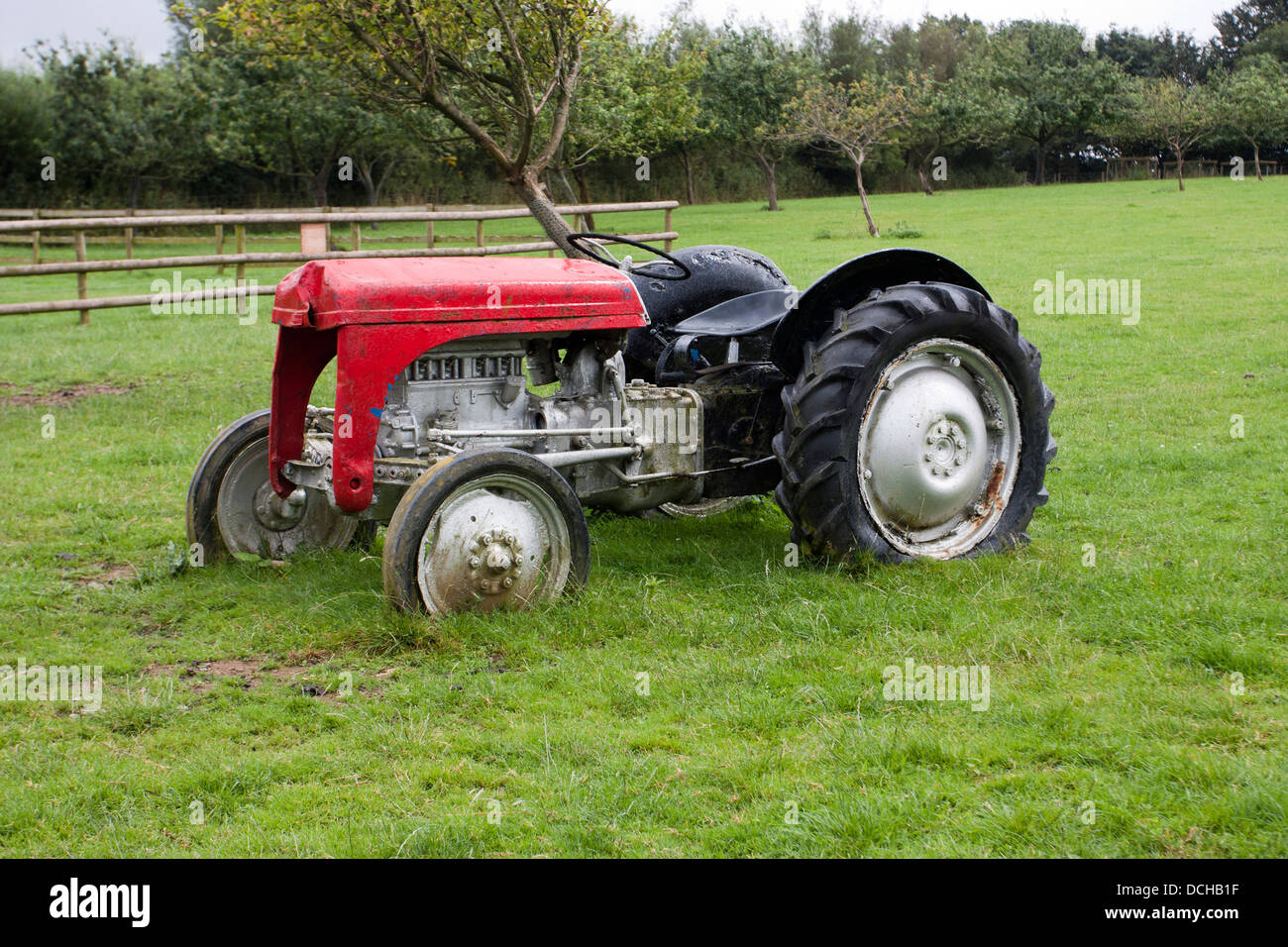 vintage style 19340's tractor in a farmyard on the grass Stock Photo ...