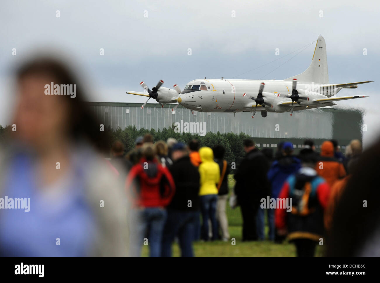 Visitors watch the start of a type Lockheed P-3 Orion maritime ...