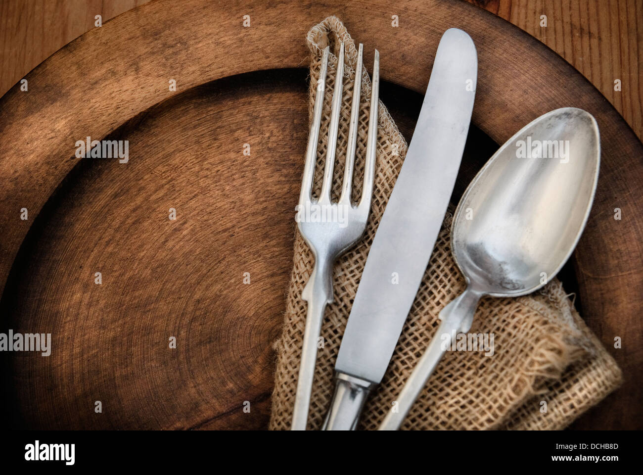 Vintage silverware on rustic wooden plate Stock Photo - Alamy