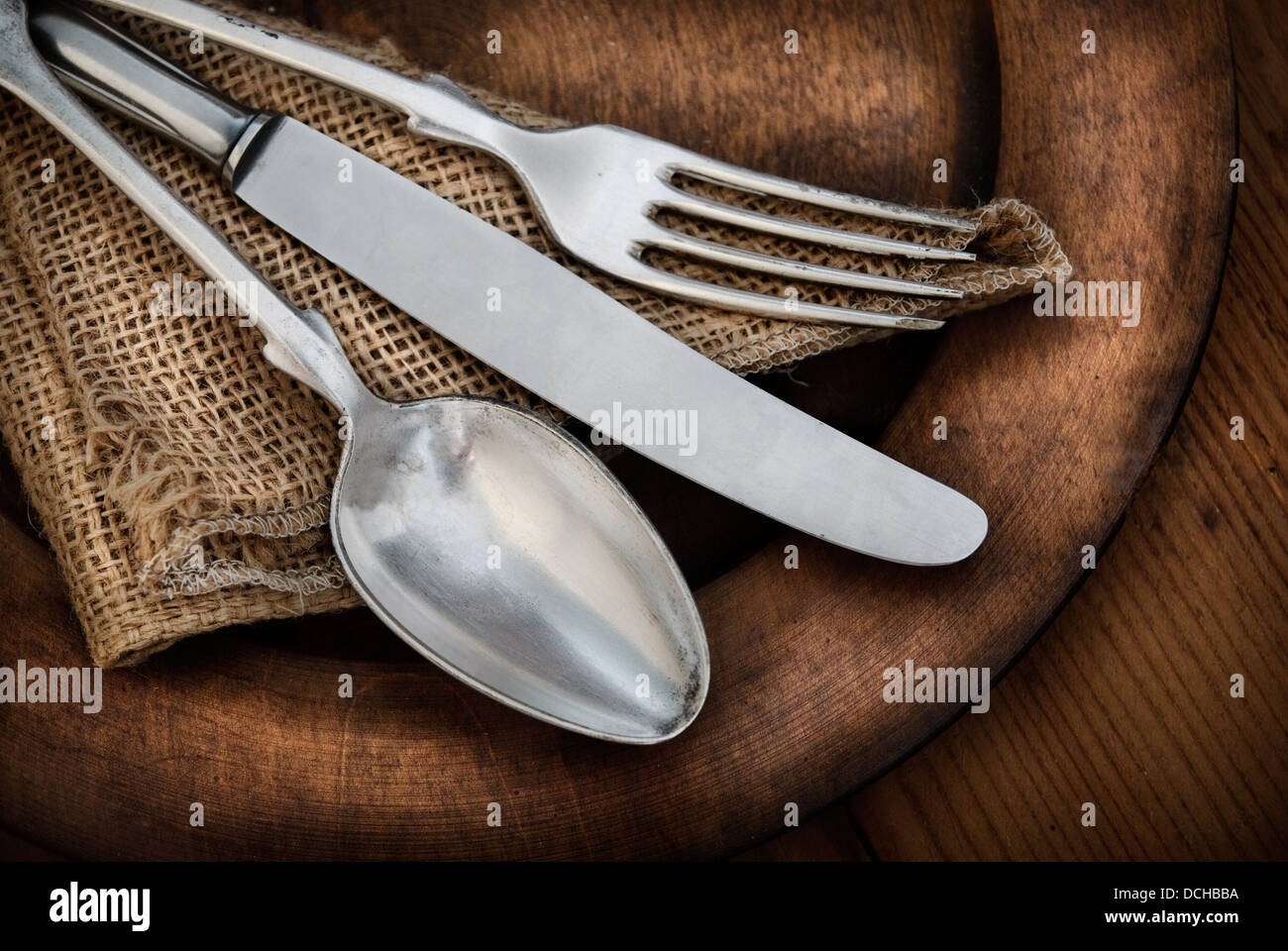 Vintage silverware on rustic wooden plate Stock Photo - Alamy