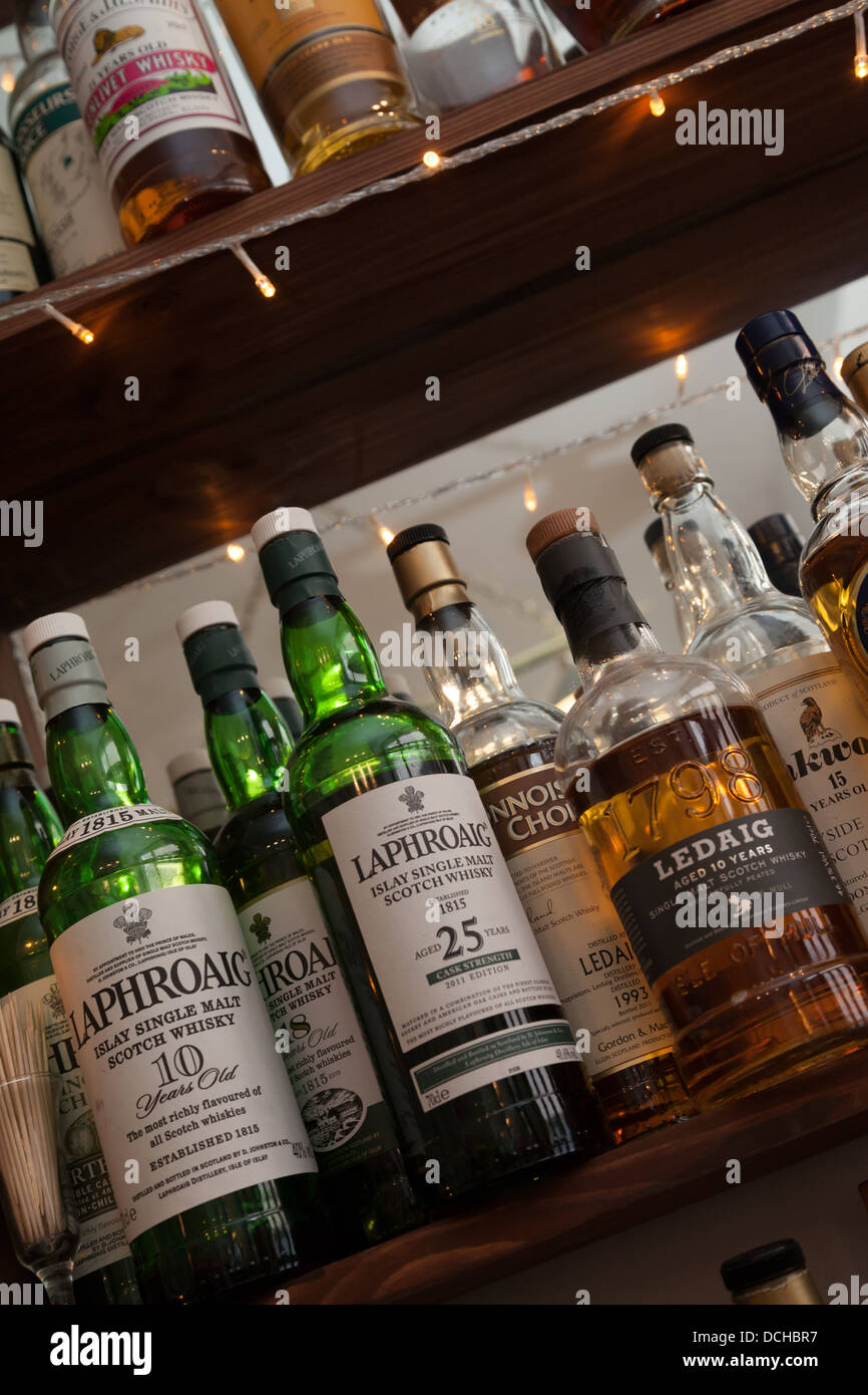 bottles of single Malt Whisky on a bar display Stock Photo - Alamy