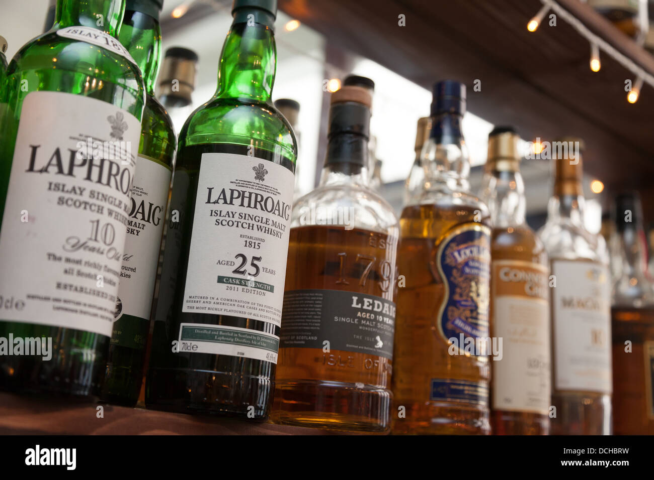 bottles of single Malt Whisky on a bar display Stock Photo - Alamy