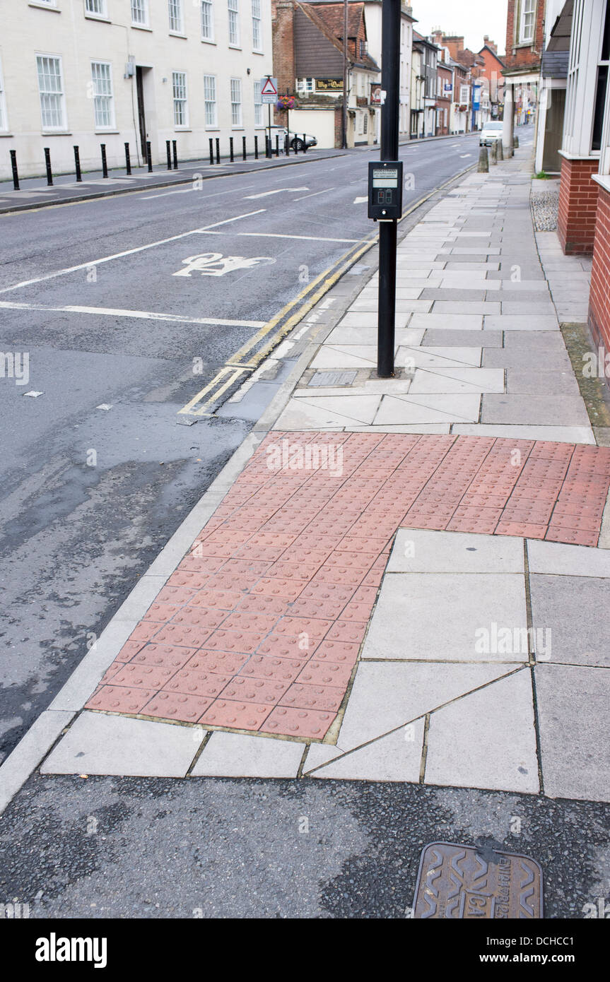 Non slip pavement sidewalk surface at UK pedestrian road crossing point ...