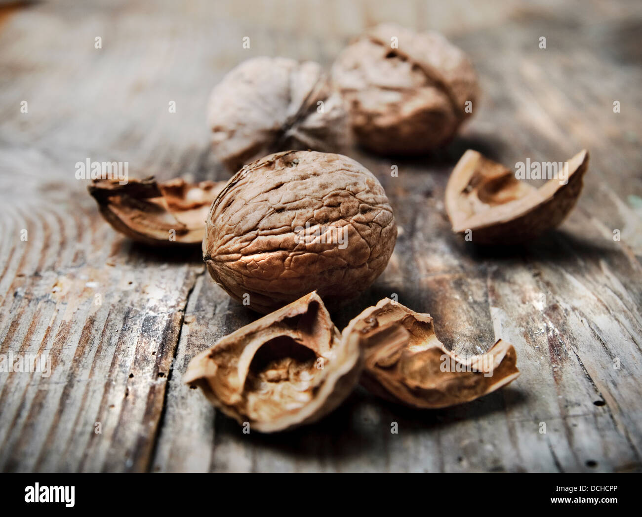 Nuts on rustic wooden table Stock Photo - Alamy